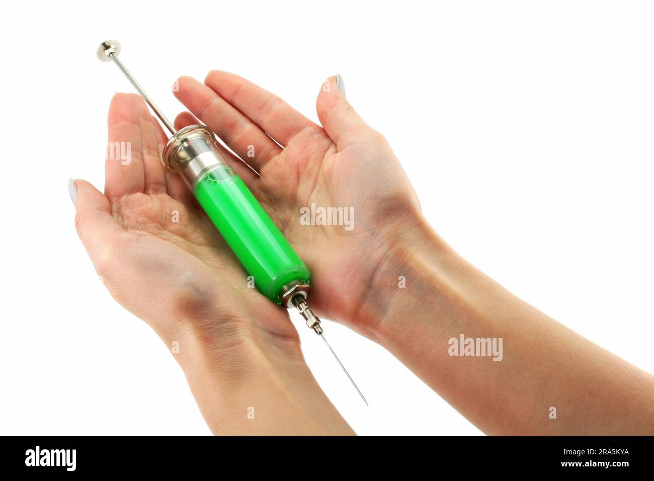 Reusable syringe with acid substance in hands isolated on a white ...
