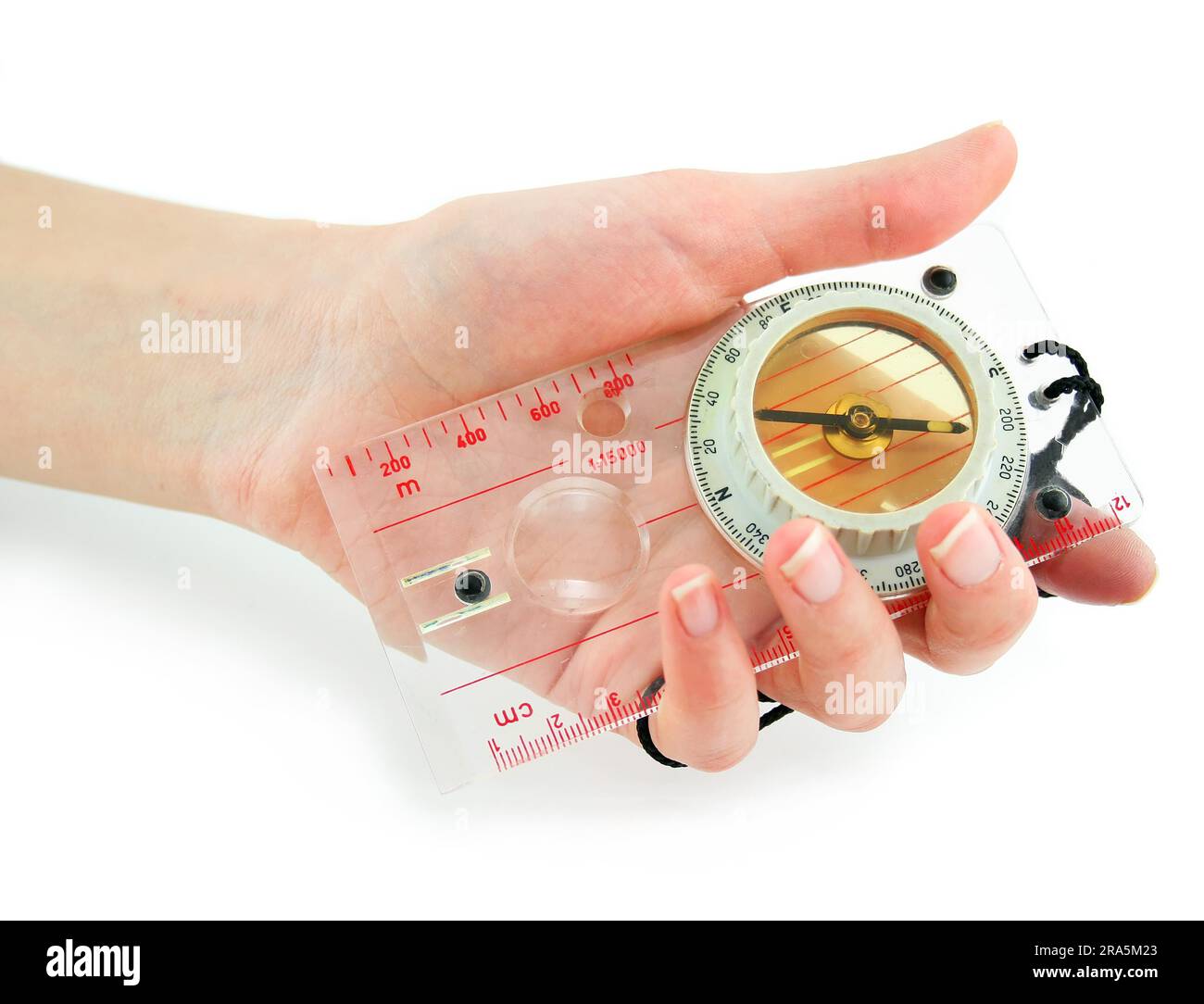 Female hand holds transparent liquid compass isolated Stock Photo - Alamy