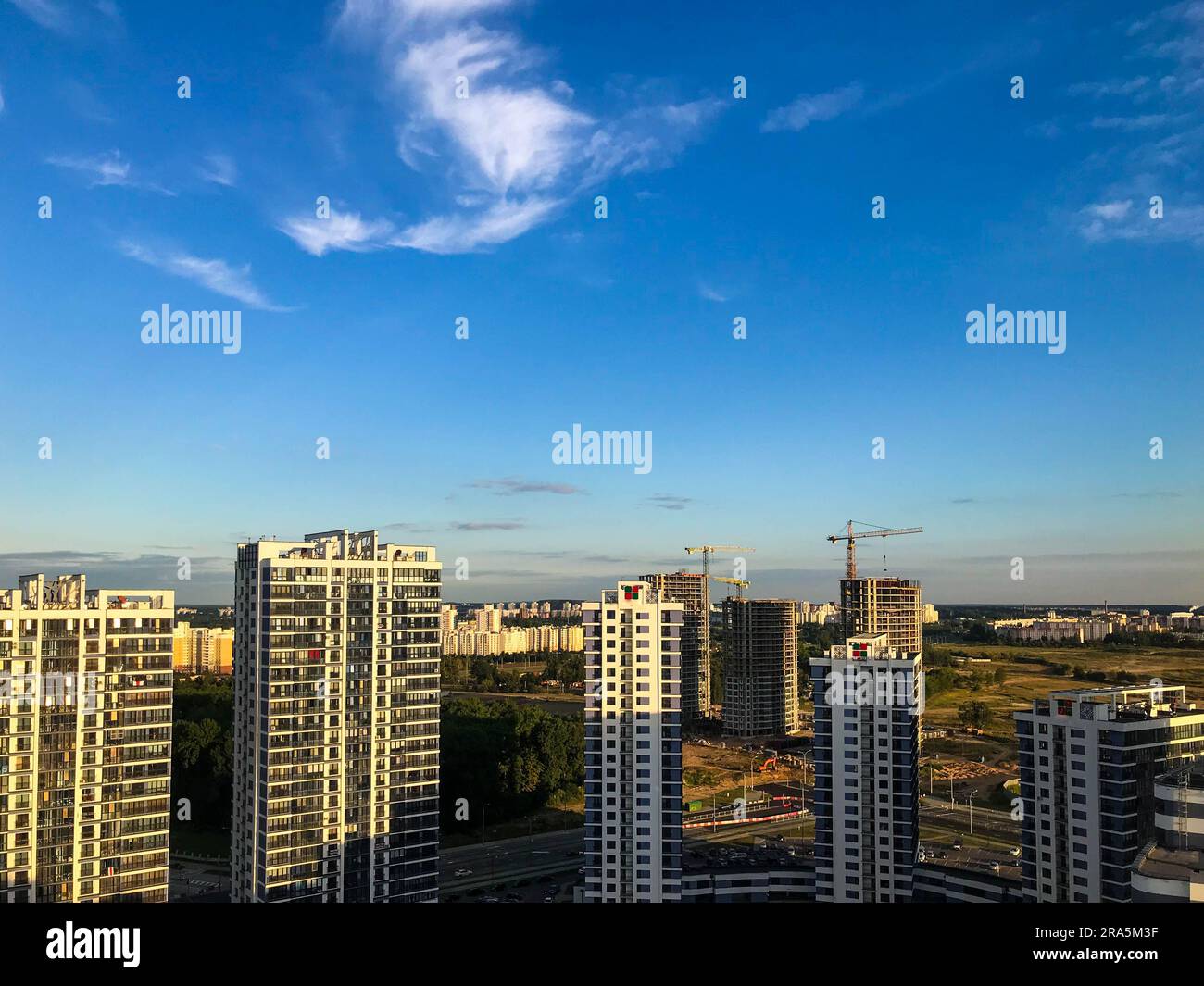 tall houses are in a new neighborhood in a semicircle. houses of ...