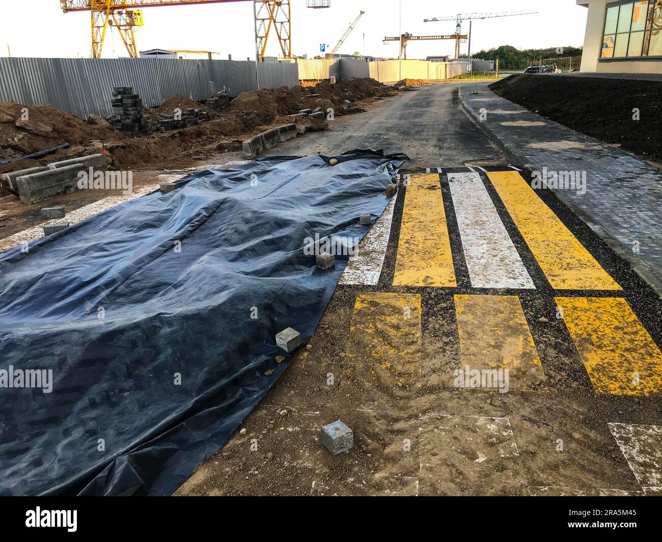 pedestrian markings on the road. creating a pattern on the asphalt. the ...