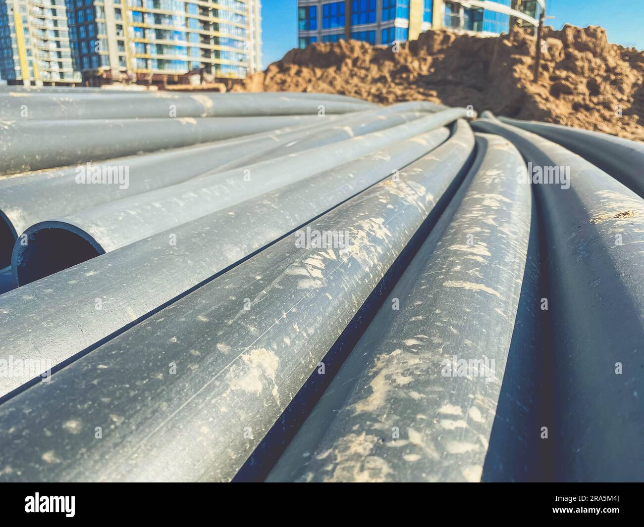 pipes for the construction of communications in the new microdistrict ...