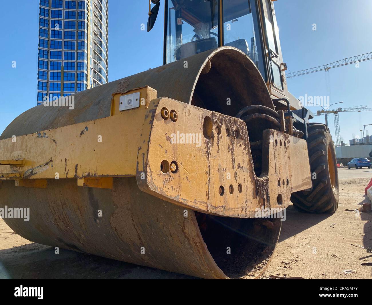 Road repair, compactor lays asphalt. Heavy special machines. Asphalt ...