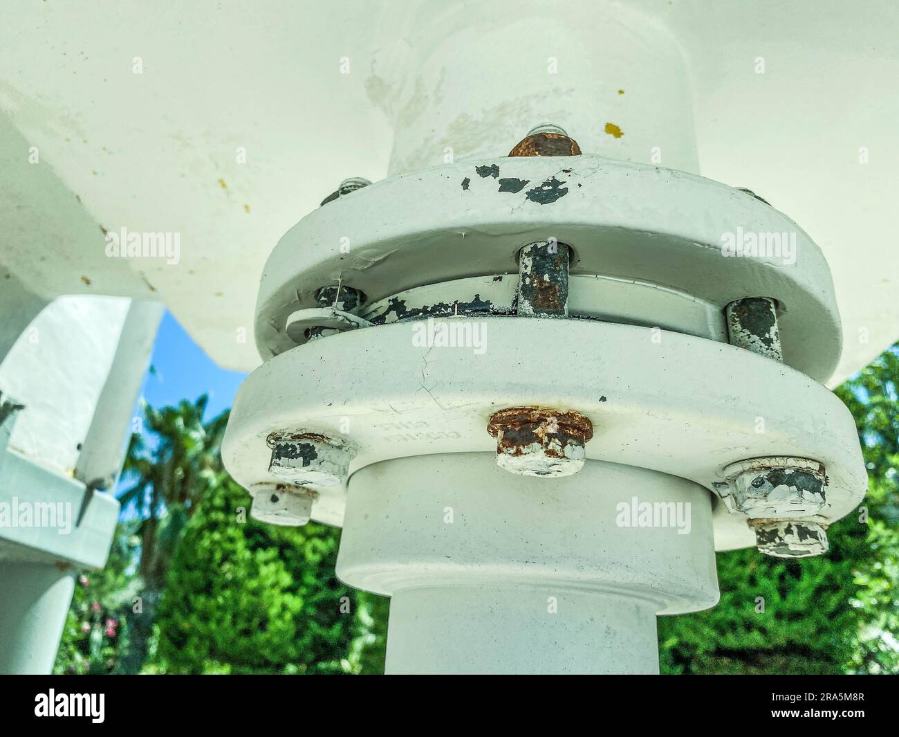 close-up view of the flange with bolts of a heavy metal joint on a pipe ...