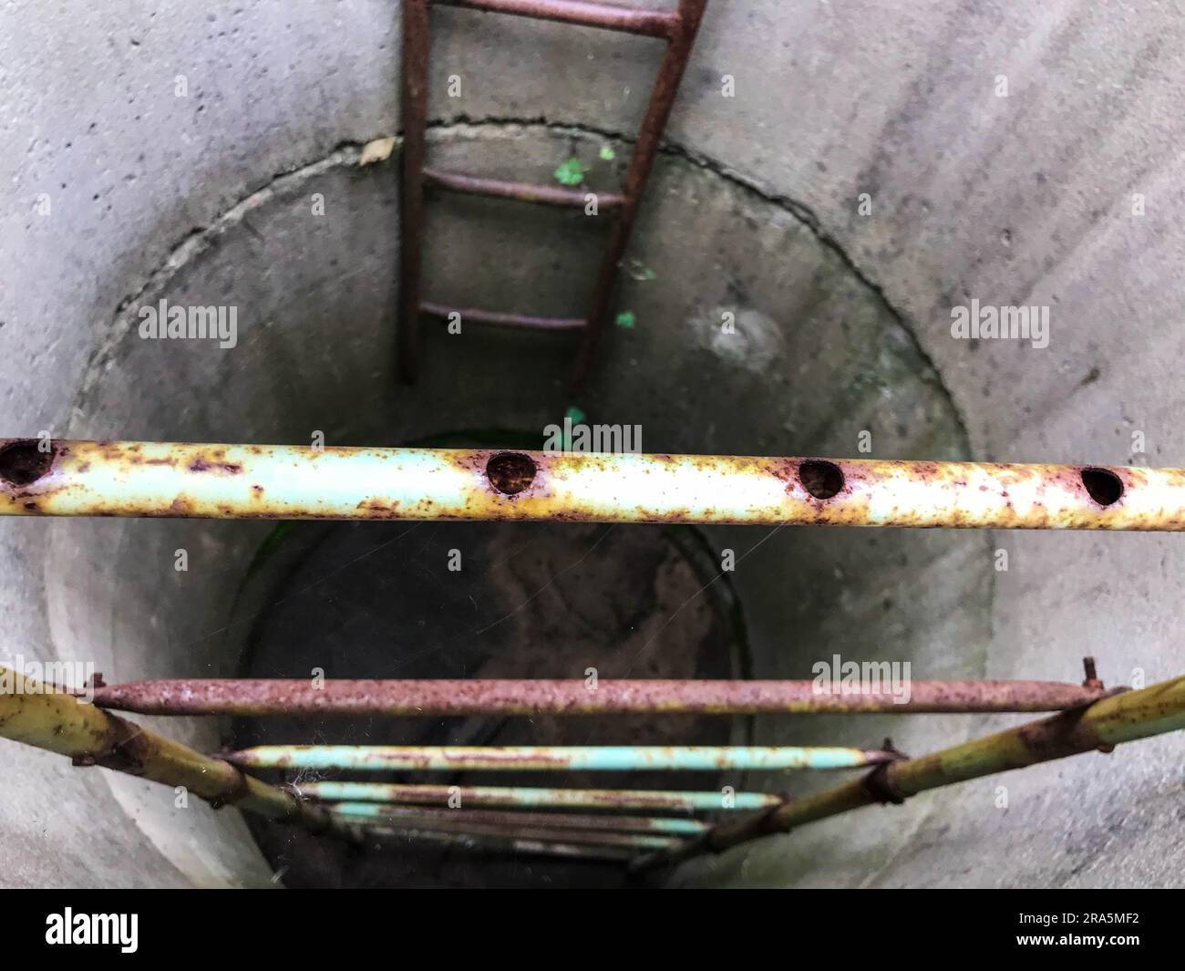 homemade well for water extraction. concrete rings are installed in the ...