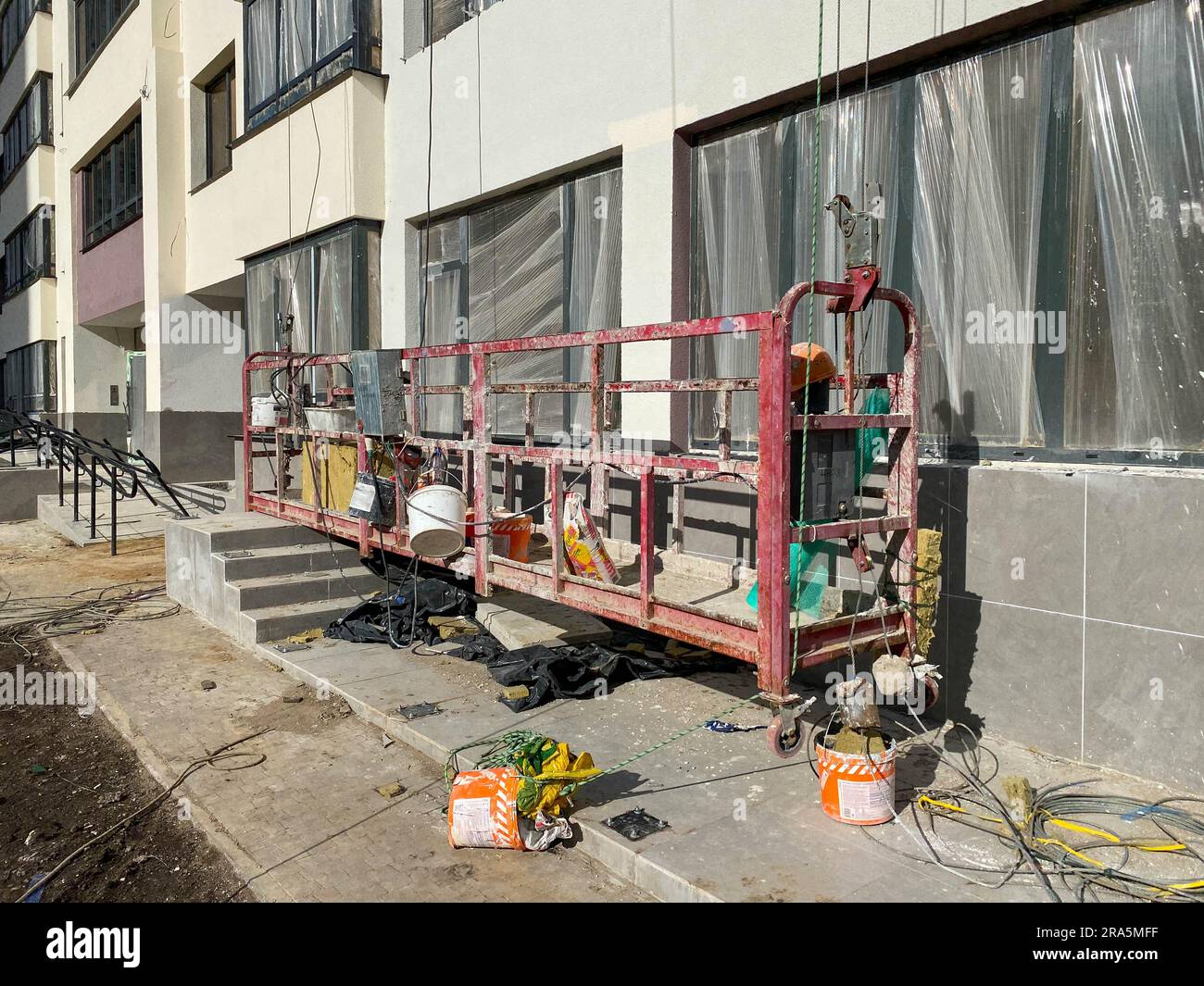 Picture of construction cradle in building site Stock Photo - Alamy