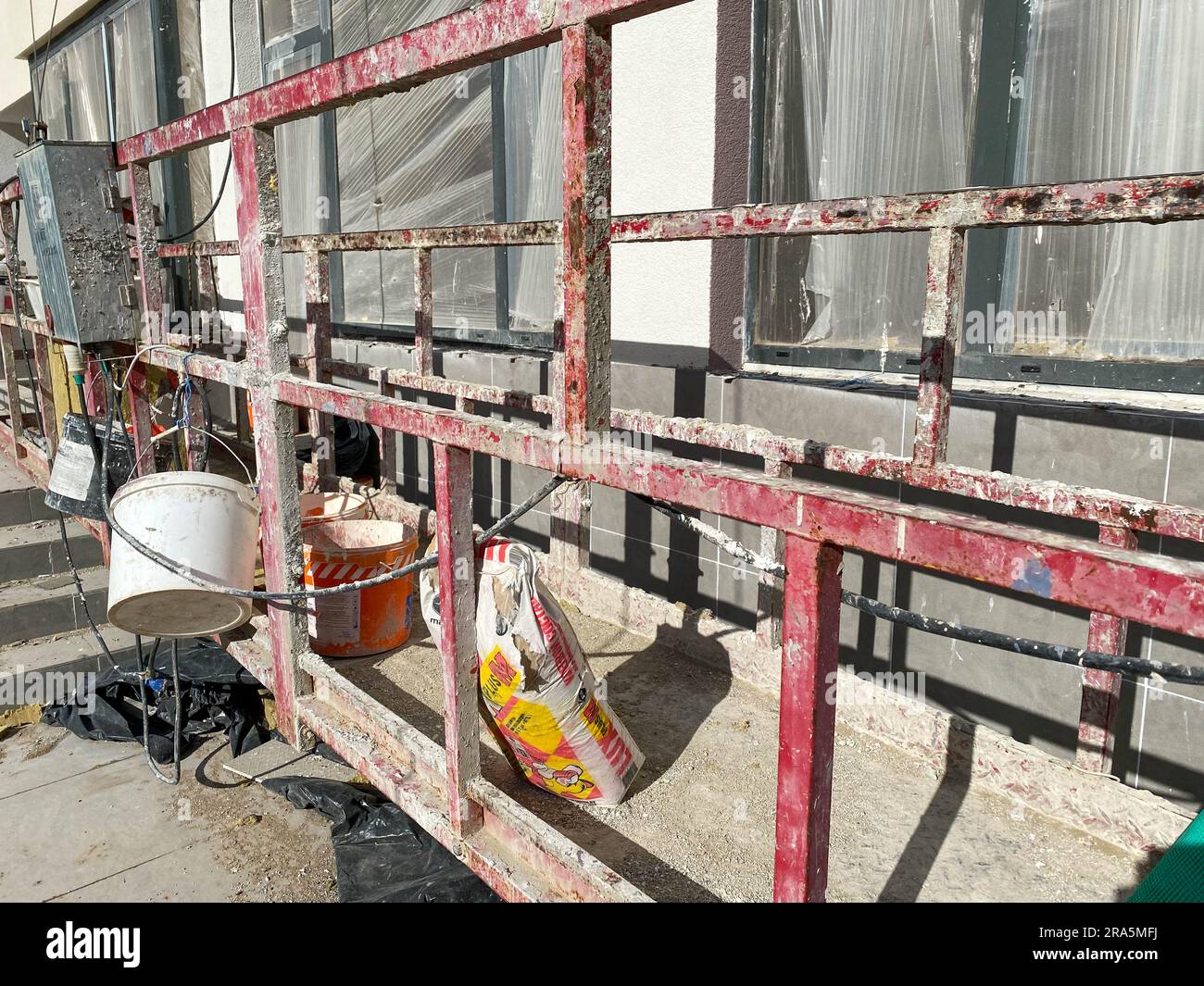 View of the facade of a new multi-storey building under construction ...