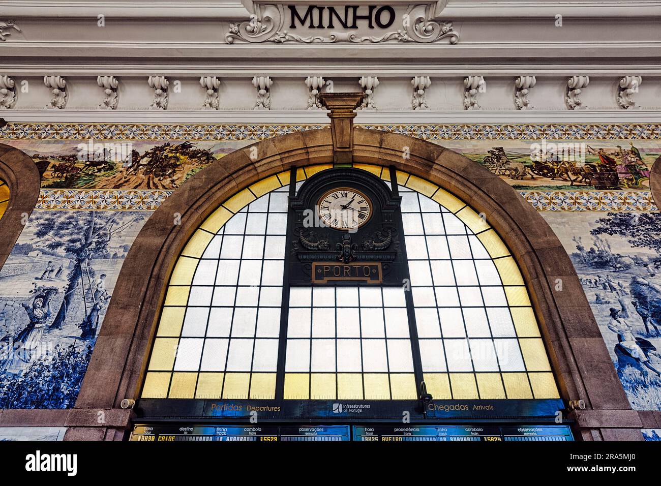 Window with station clock and lettering Minho, station hall in Sao ...
