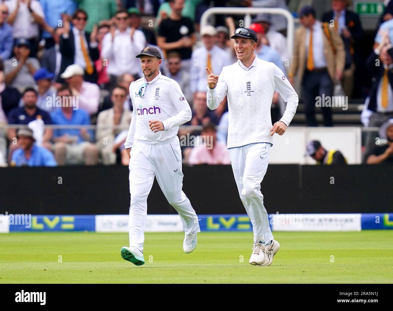 England's Zak Crawley (right) celebrates after making the catch to take ...