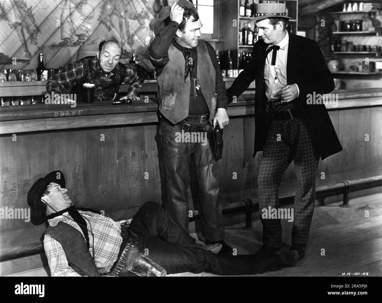 PAT WEST as bartender THOMAS MITCHELL as Pat Garrett and WALTER HUSTON ...