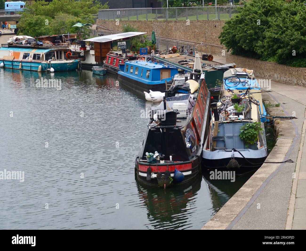 London, UK - June 2023 : Barges and canal boats on the Regents Canal ...
