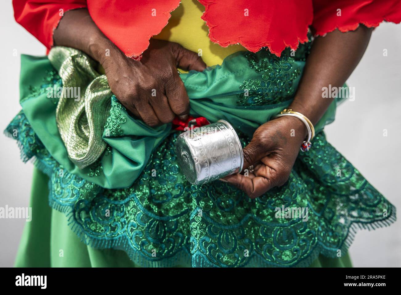 AMSTERDAM - A woman puts on her traditional clothing. The abolition of ...