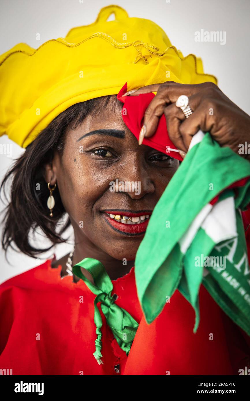 AMSTERDAM - A woman puts on her traditional clothing. The abolition of ...