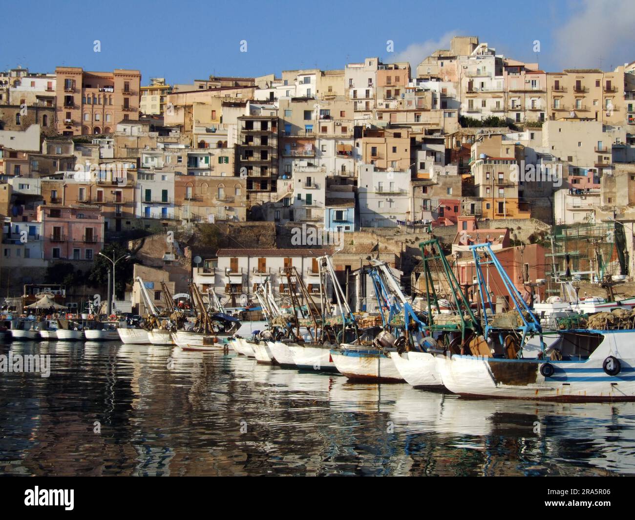 Boats in fishing harbour, view of old town, Sciacca, Sicily, Italy ...
