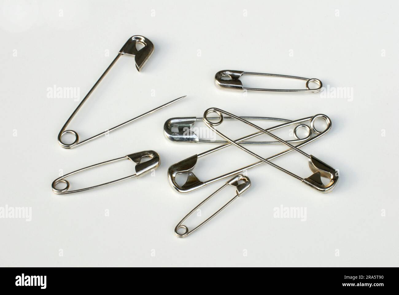 Safety pins, cut-out, object Stock Photo - Alamy