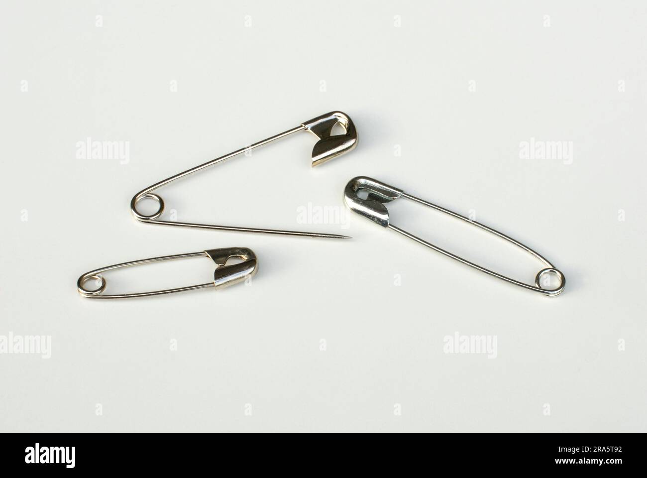 Safety pins, cut-out, object Stock Photo - Alamy