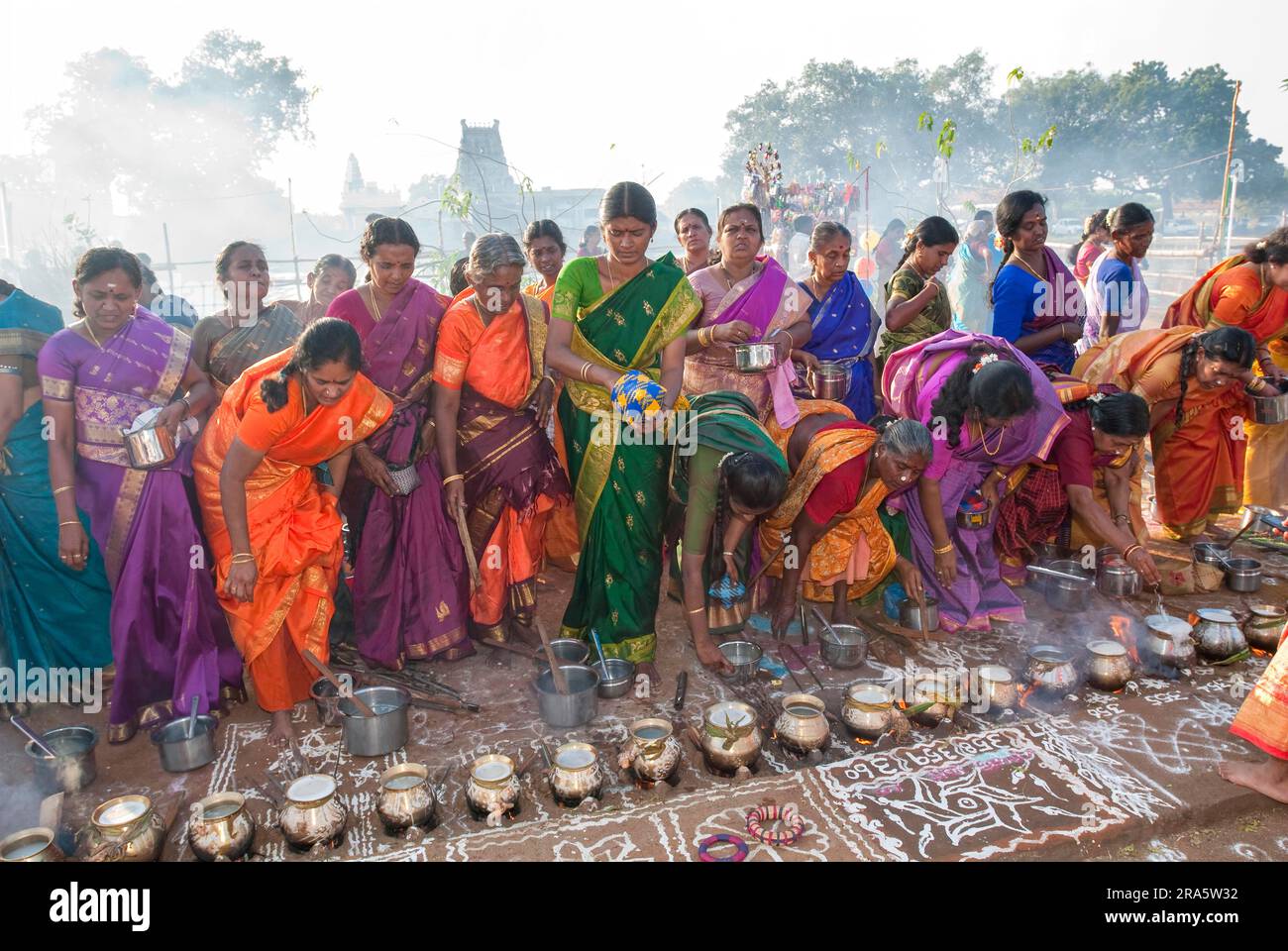 Women celebrating Sevvai Tuesday Pongal festival on firewood stove ...
