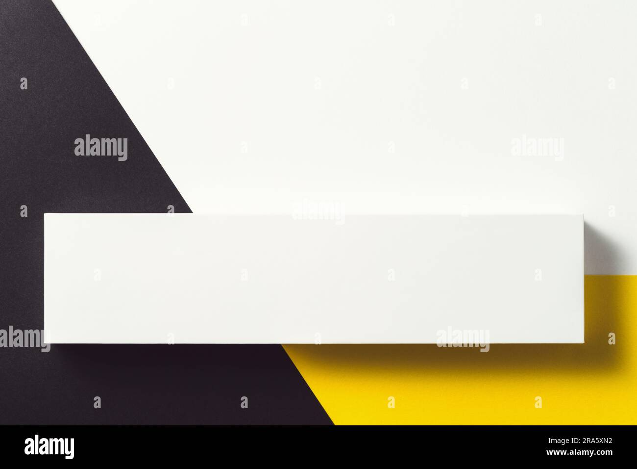 White no name gift box mockup on black, yellow and white background ...
