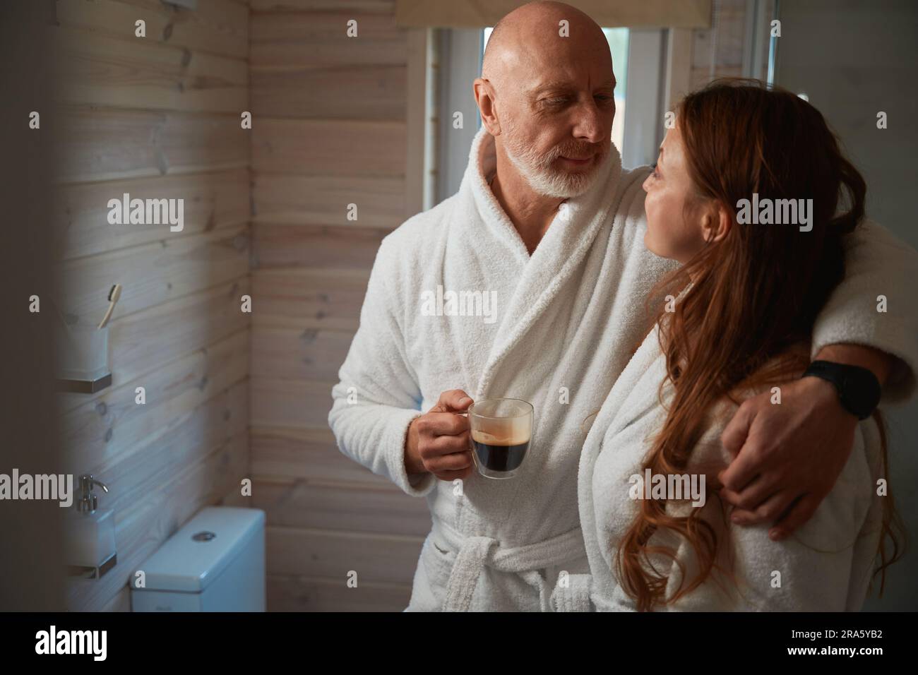 Husband hugging wife in bathroom hi-res stock photography and images ...