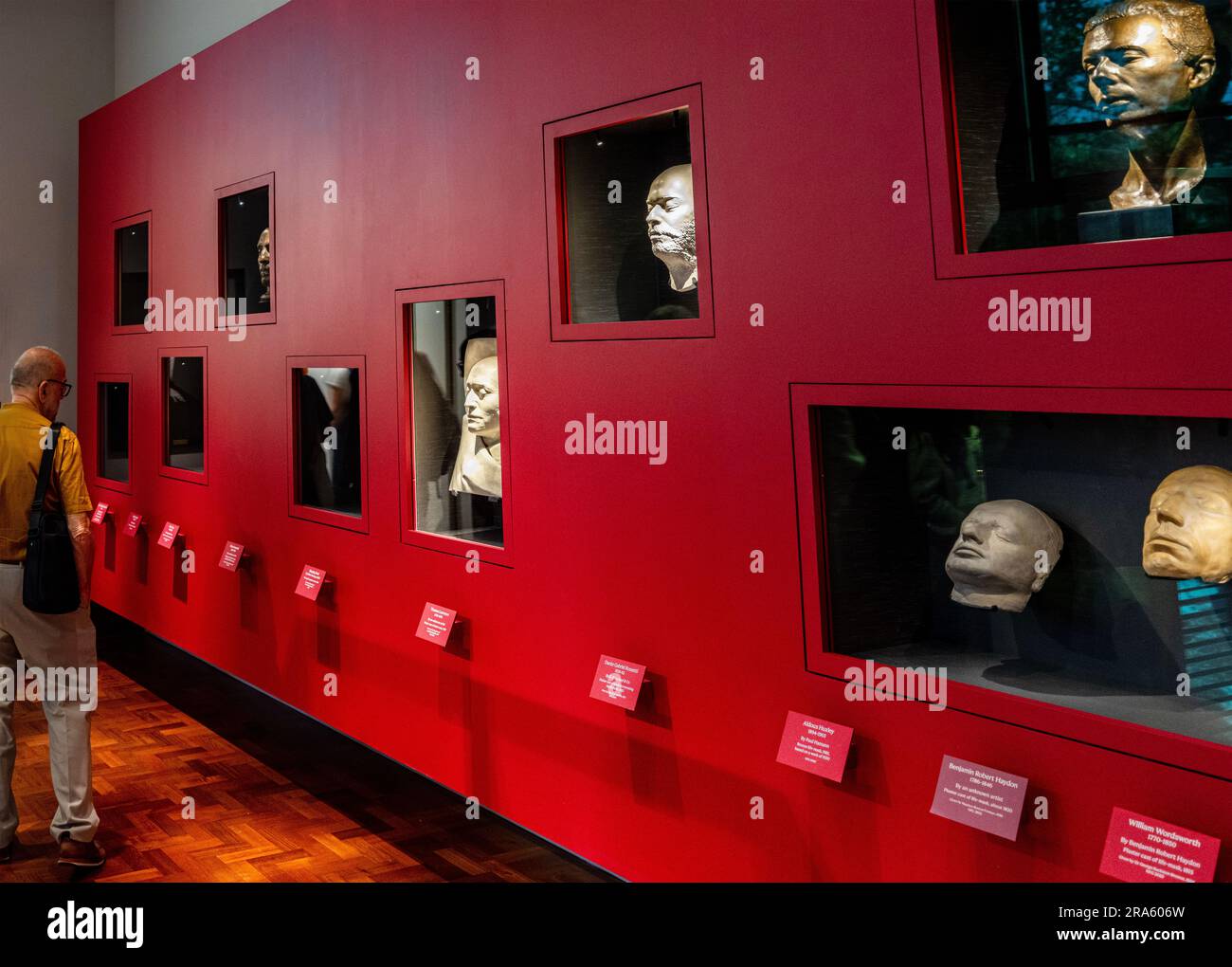 Red painted wall with life masks in The National Portrait Gallery ...