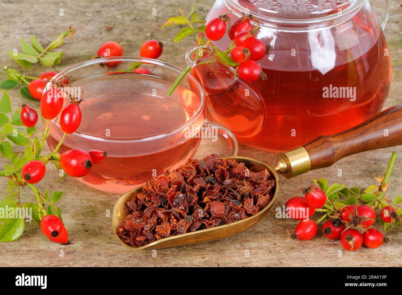 Cup and teapot with rose hip tea, dried rose hips (Pink Stock Photo - Alamy