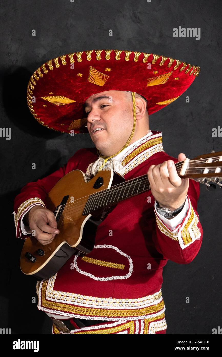 Mexican mariachi musician on a black background Stock Photo - Alamy