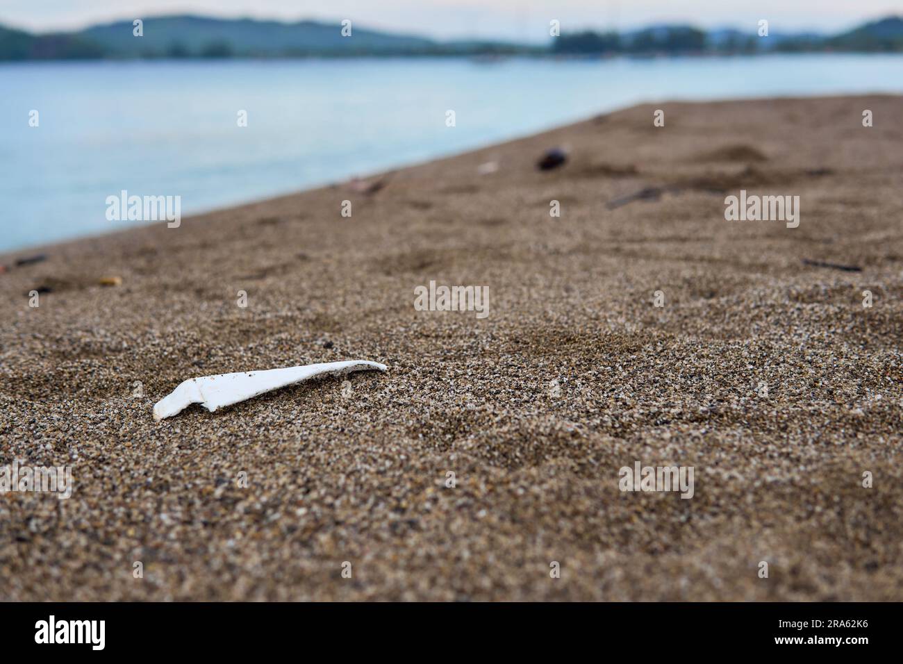 photo of trash or marine garbage on the beach Stock Photo - Alamy