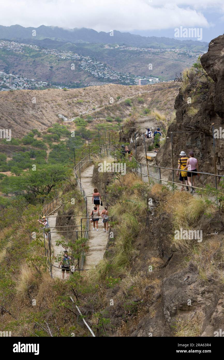 Hikers on footpath to Diamond Head tuff formation, Oahu, Hawaii, O'ahu ...