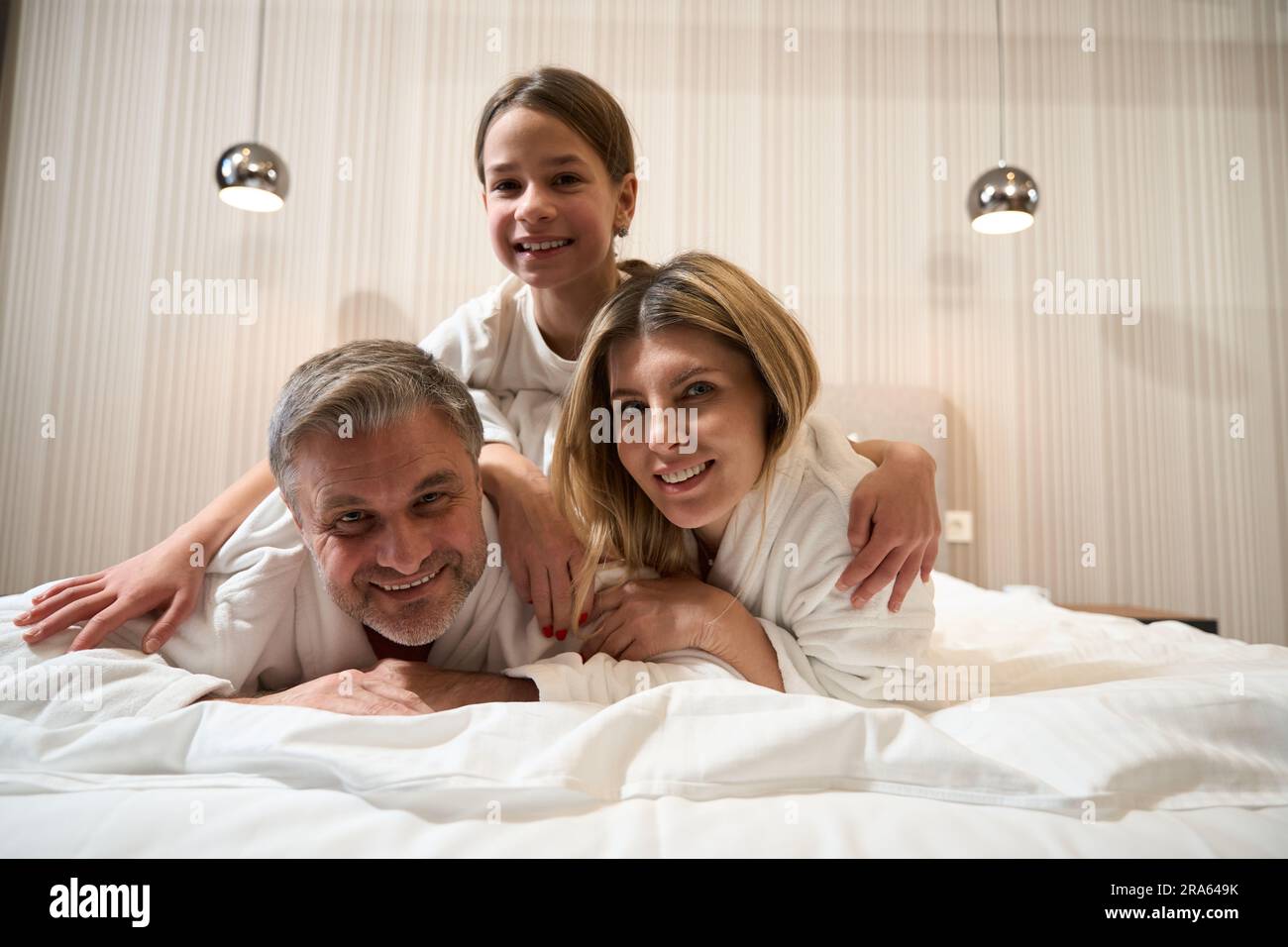 Smiling family resting in the hotel room Stock Photo - Alamy