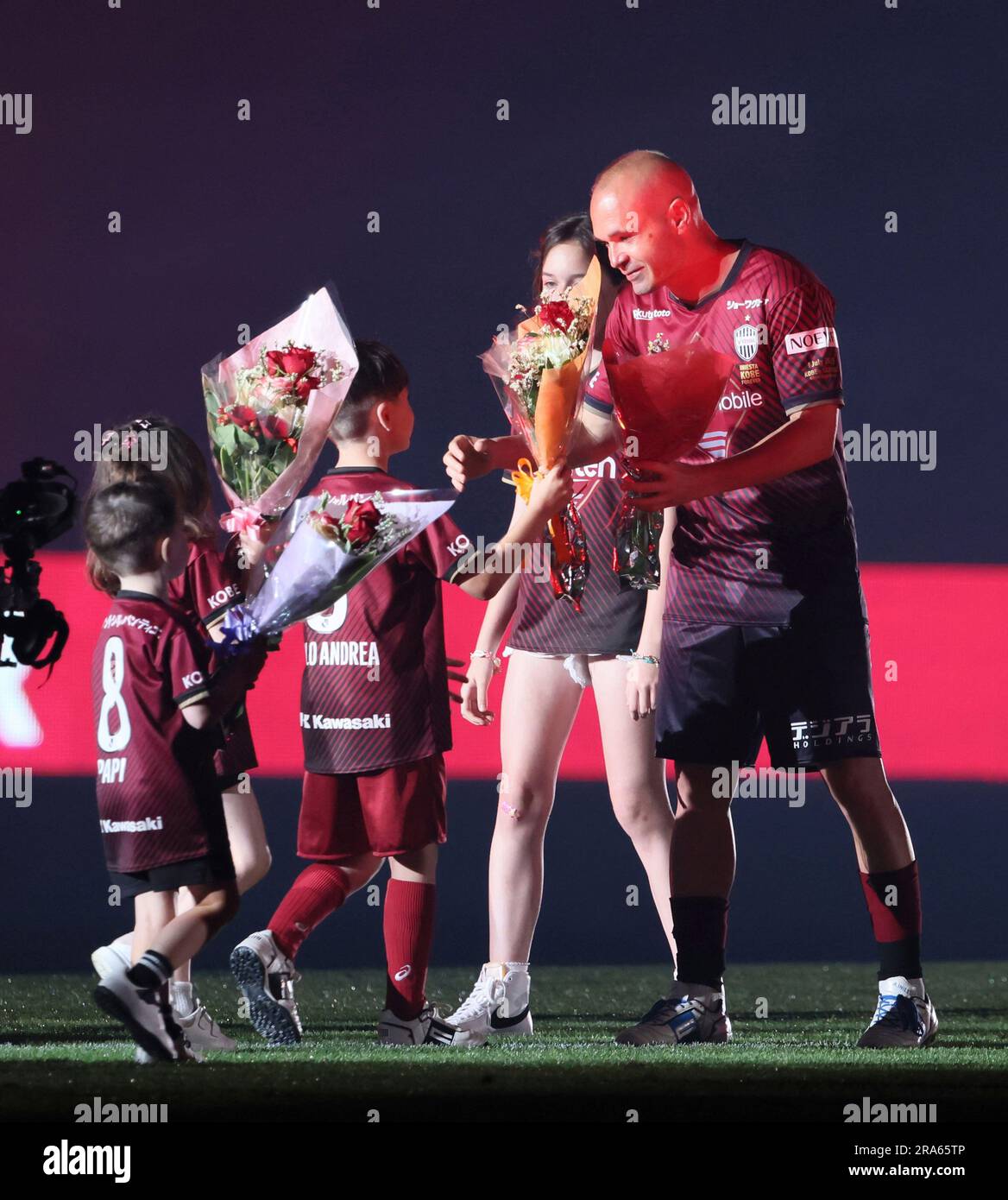 Spanish Andres Iniesta of Vissel Kobe receives flowers with his family ...