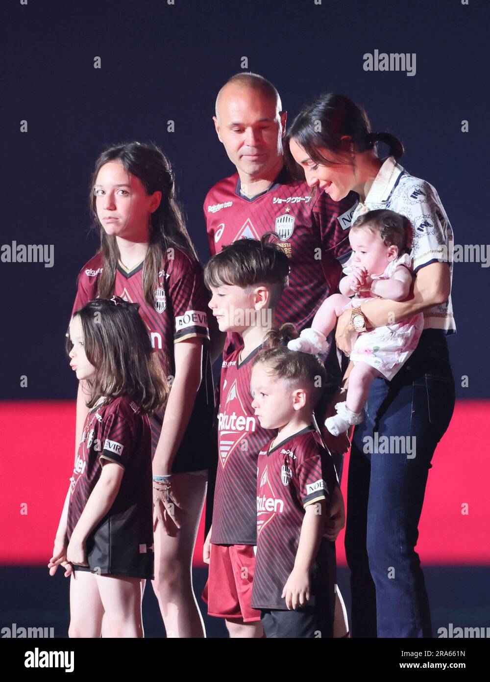 Spanish Andres Iniesta of Vissel Kobe receives flowers with his family ...