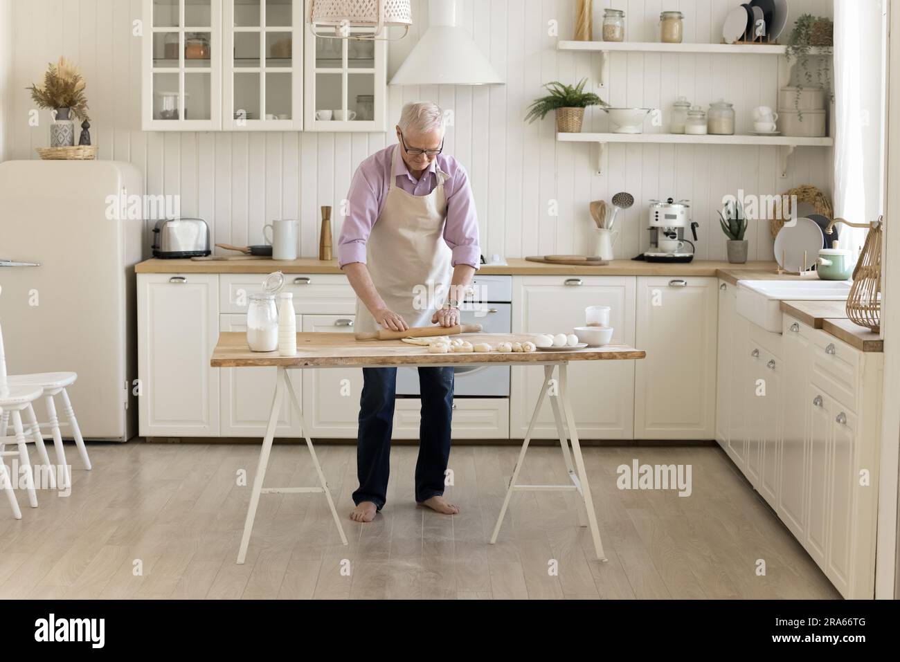 Male baker in apron hi-res stock photography and images - Alamy