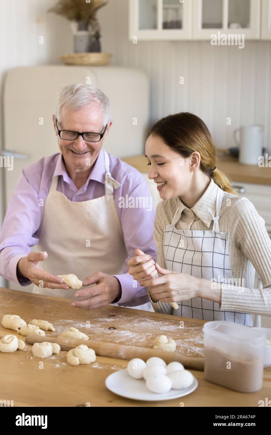Happy granddad enjoying retirement, family meeting, domestic activities ...