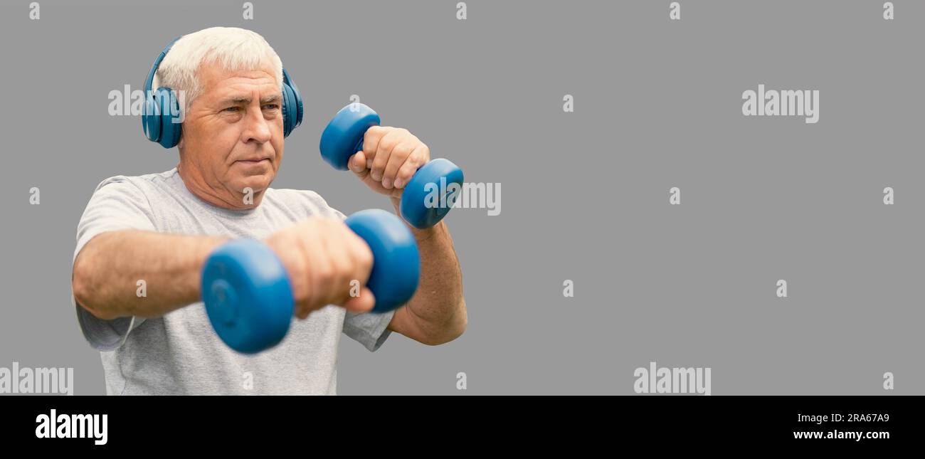 Senior man working out banner. Gray Stusio background. Person lifting ...