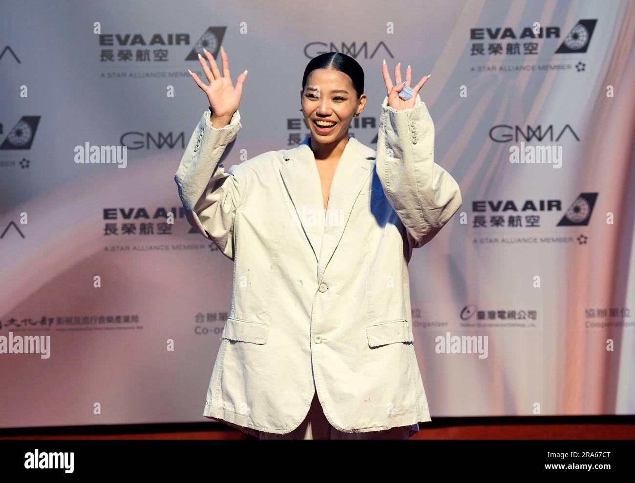 Taiwanese singer Hung Pei-Yu poses for a photo as she arrives for the ...