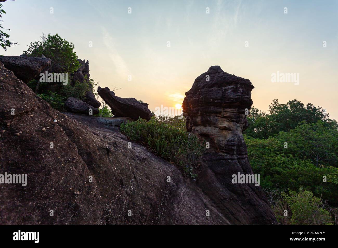 scenery sunrise at weird shaped rock. These stones have been ...