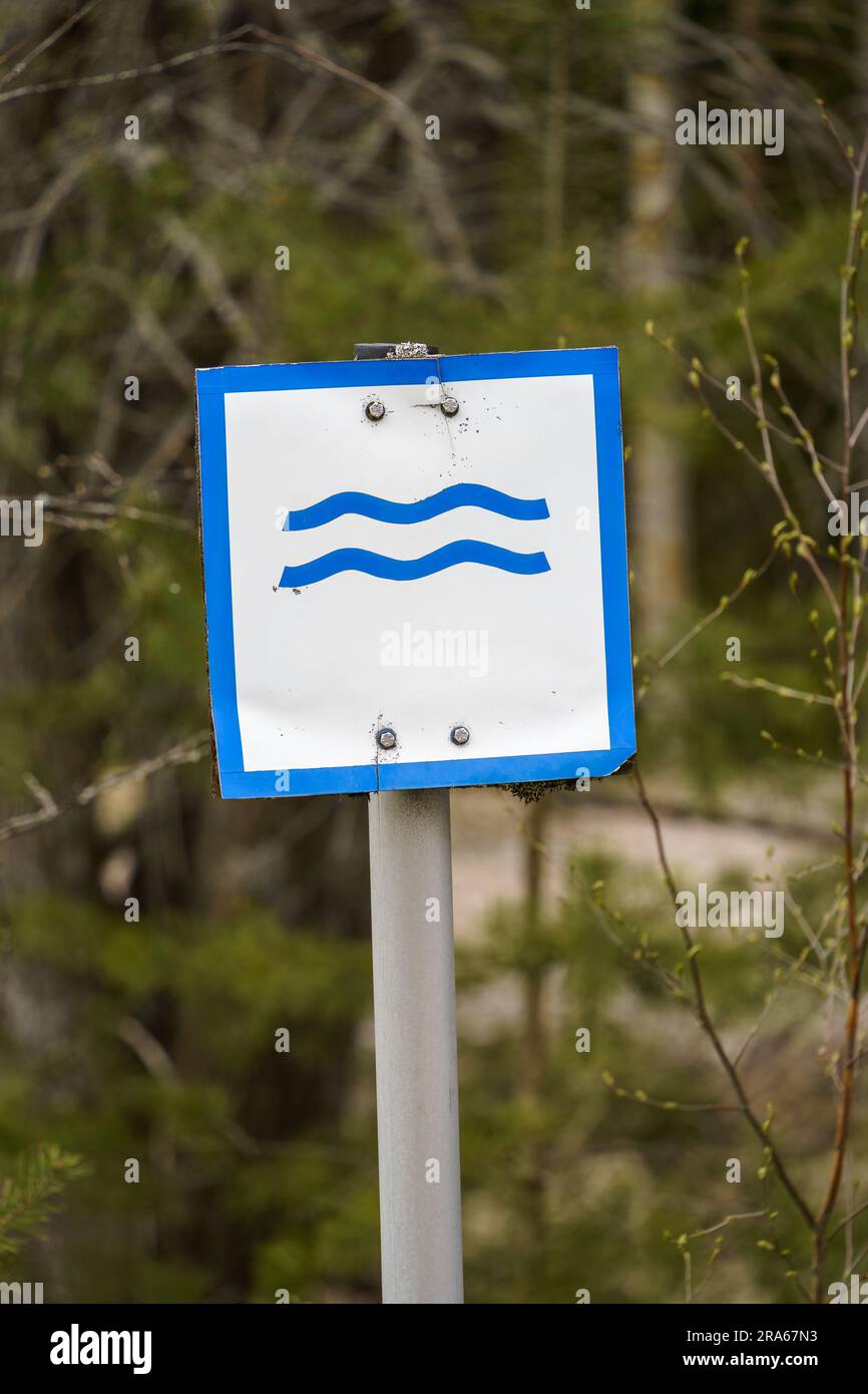 Groundwater area sign with blue waves, close up Stock Photo - Alamy