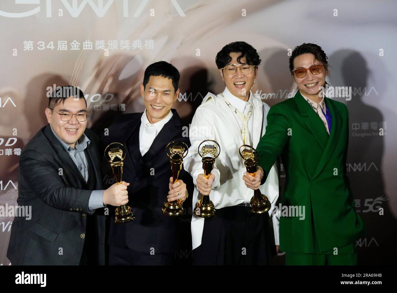 Taiwanese pop group Cosmos People hold their awards as Best Band at the ...
