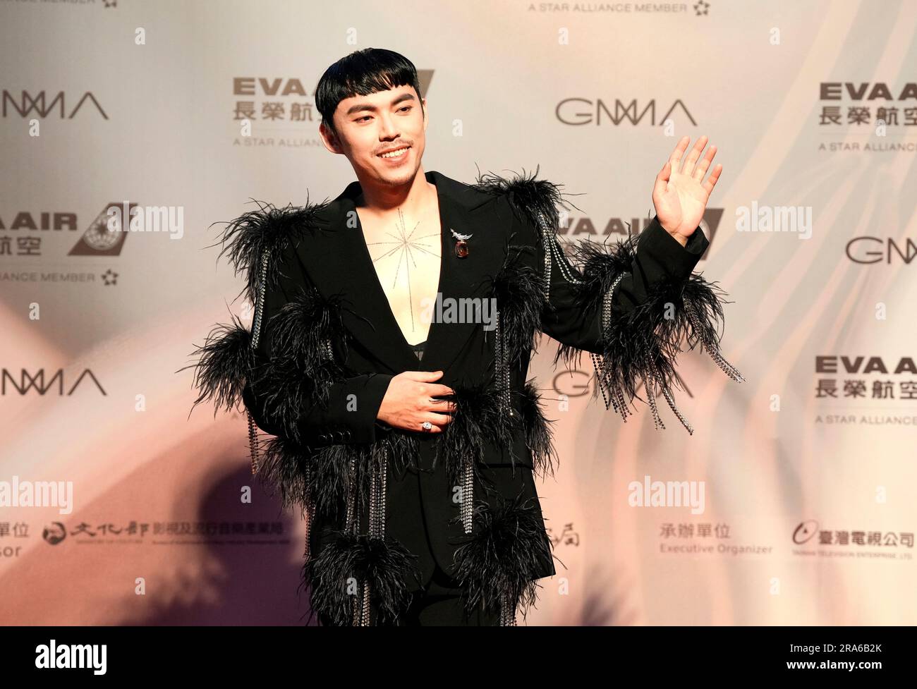 Taiwanese singer Hush poses for a photo as he arrives for the 34th ...