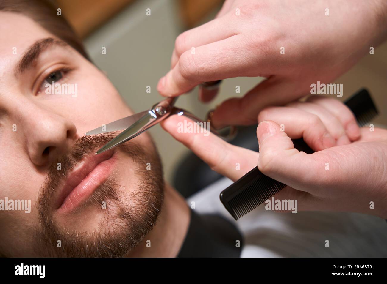 Professional barber cuts clients hair hi-res stock photography and ...