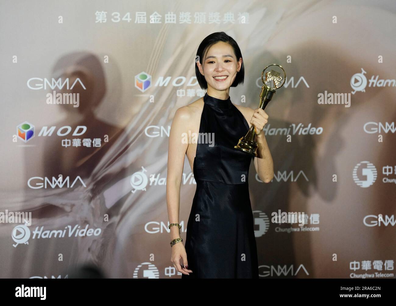 Taiwanese singer Anpu holds her award for Song of the Year at the 34th ...