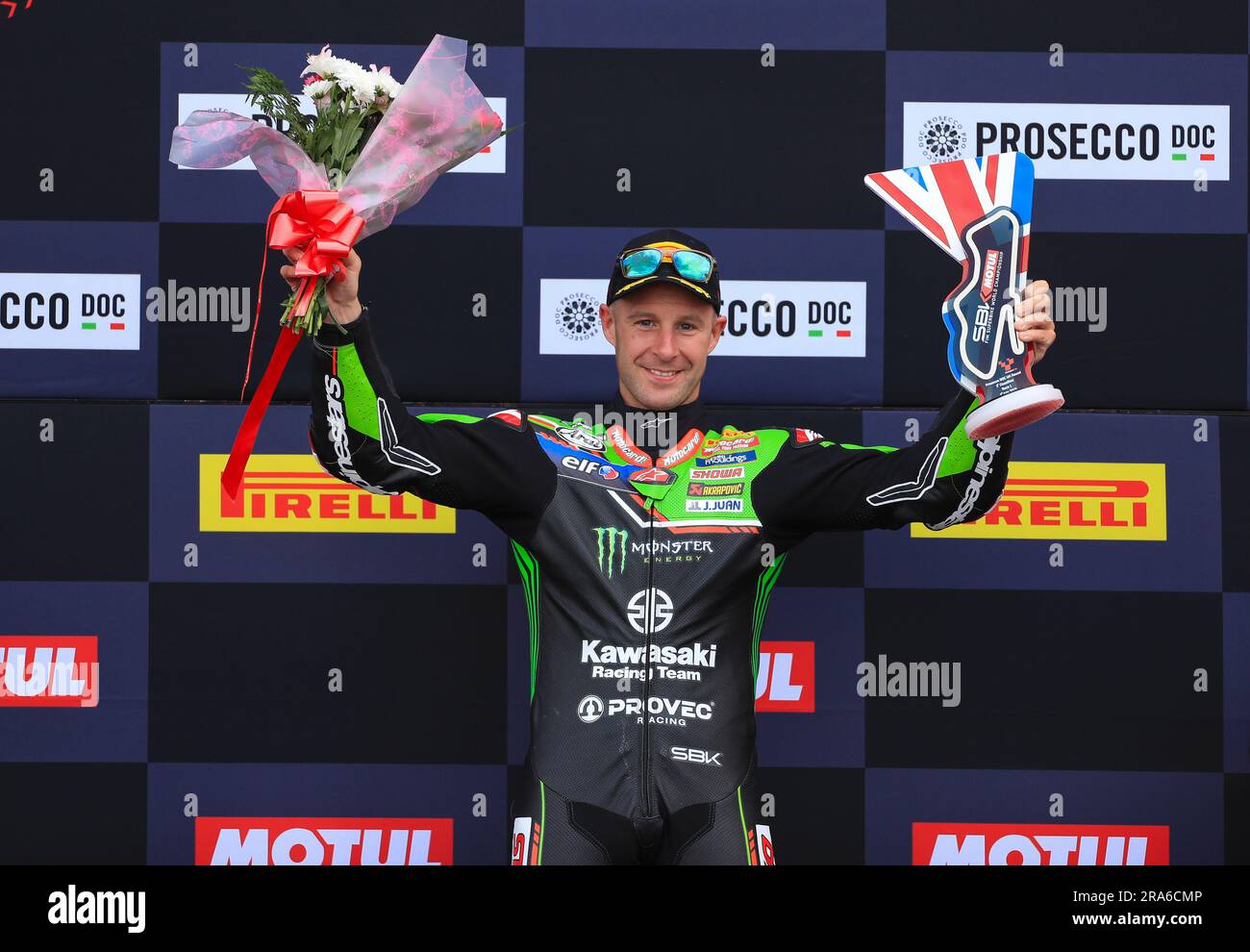 Kawasaki Racing rider Johnathan Rea celebrates with his trophy on the ...