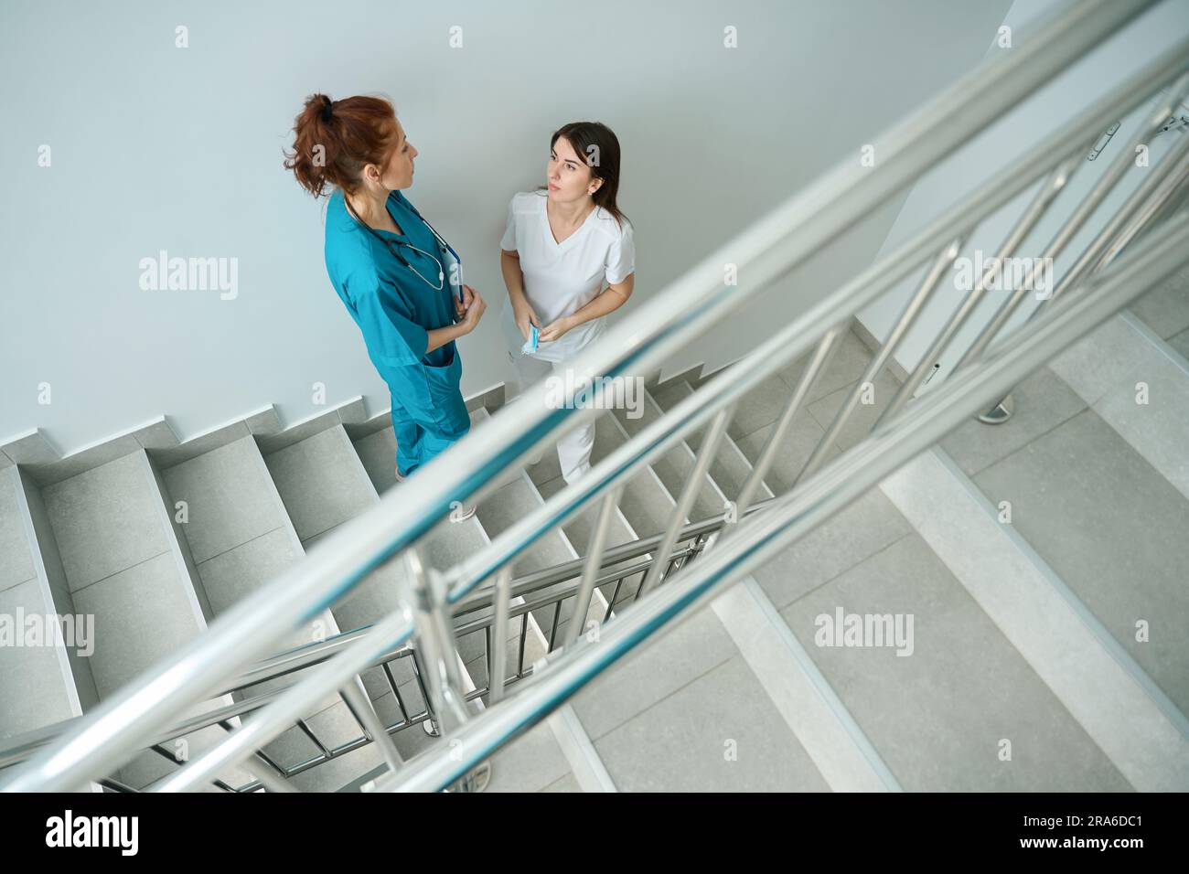Health specialists standing on the stairs in the hospital Stock Photo ...