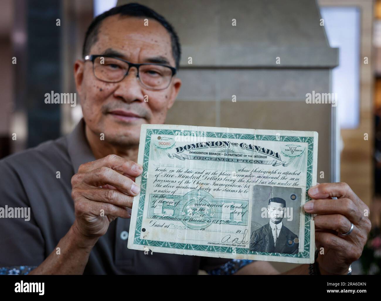Calgary, Canada. 30th June, 2023. Matthew Yan holds his father's ...