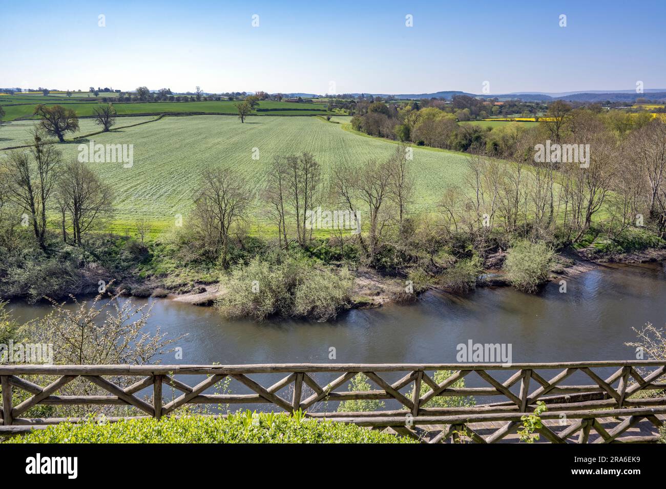 View across the river to farmland fron The Weir Gardens Heredfordshire ...