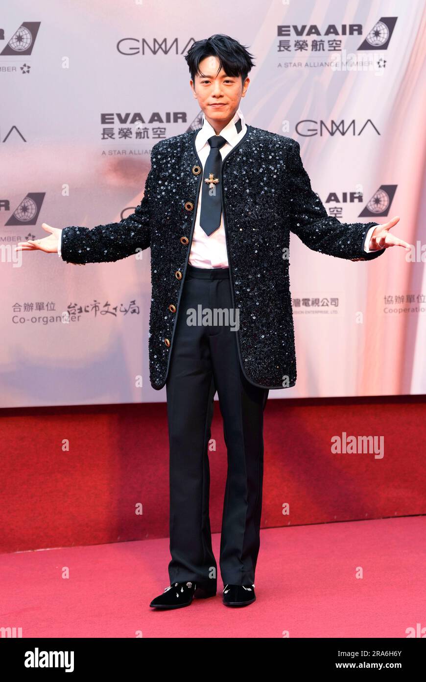 Taiwanese singer William Wei poses for a photo as he arrives for the 34th Golden Melody Awards ...