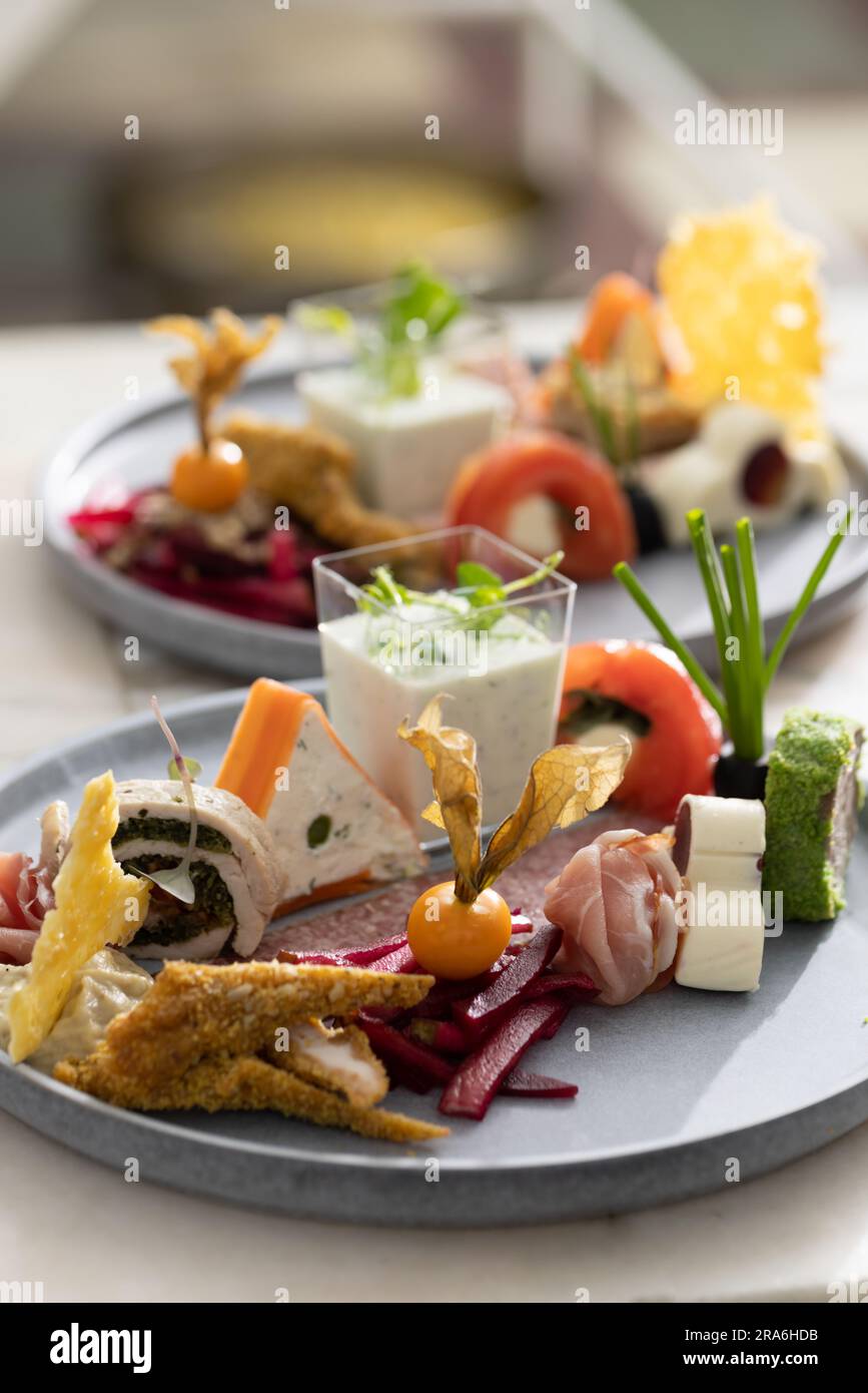 Catering banquet table, appetizers plate with different food snacks ...