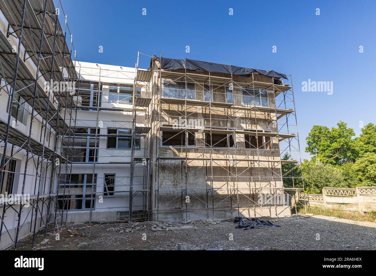 Building construction site with scaffolding. Building under ...