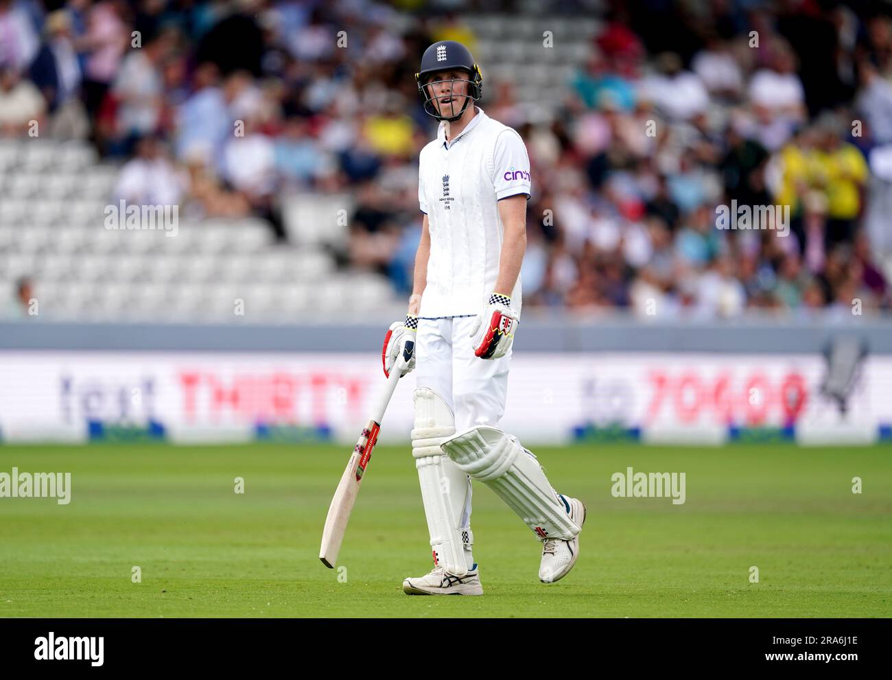 England's Zak Crawley walks off after Australia's Alex Carey (not ...