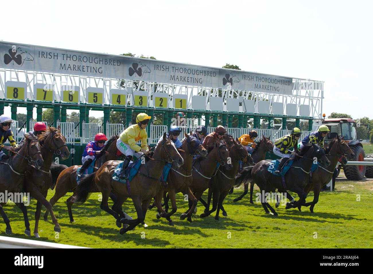 Sequence of jockeys and their horses leaving the starting gates at York ...