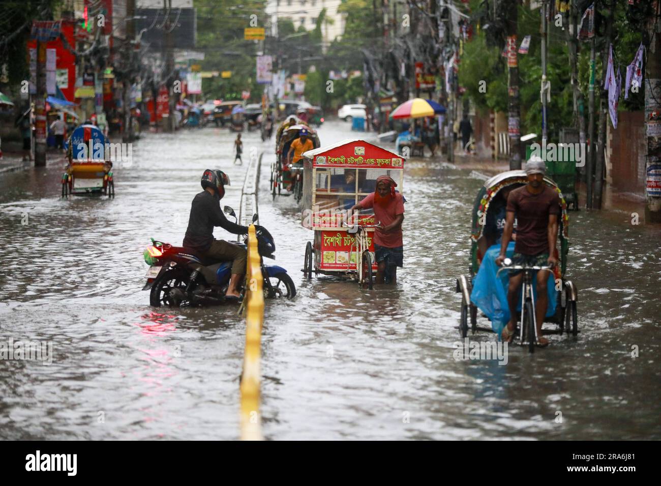 Dhaka, Bangladesh. 01st July, 2023. Vehicles make their way through a ...